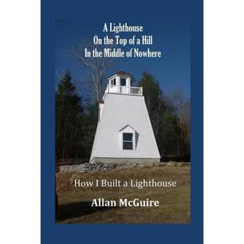A Lighthouse on the Top of a Hill in the Mid...